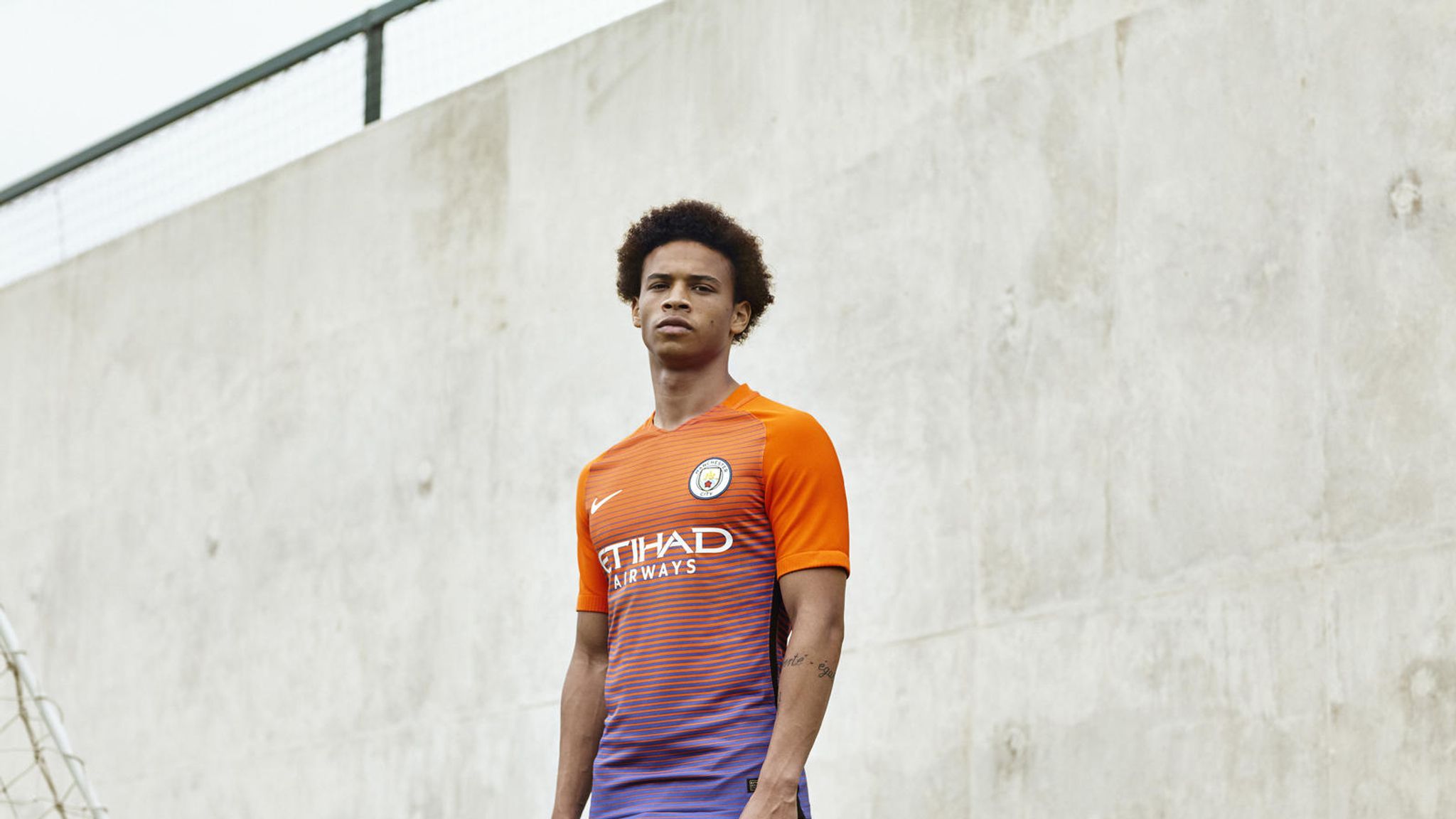Manchester City launch new striking orange and purple third kit ...