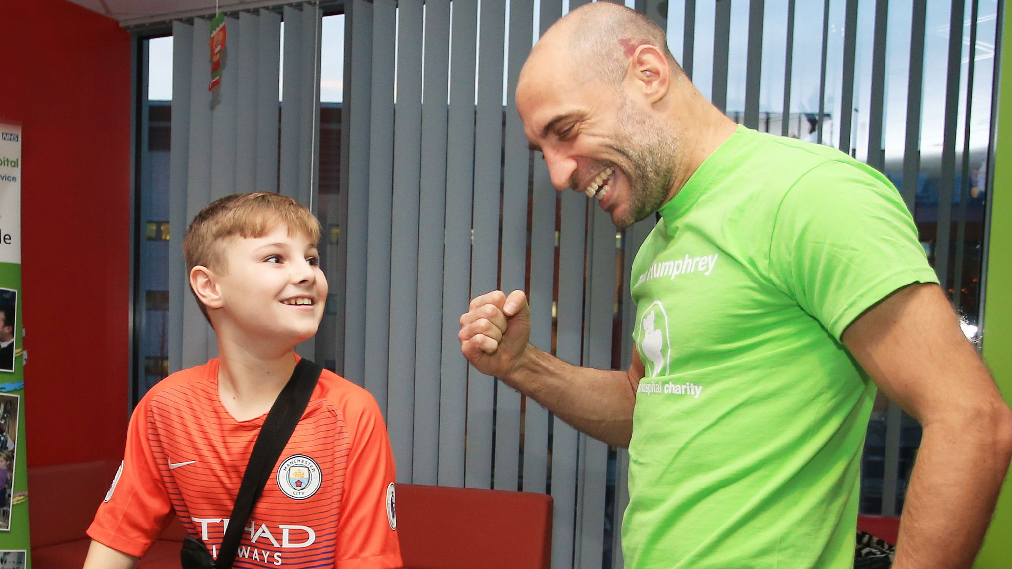 Pep Guardiola and Man City stars play Santa at local hospital ...
