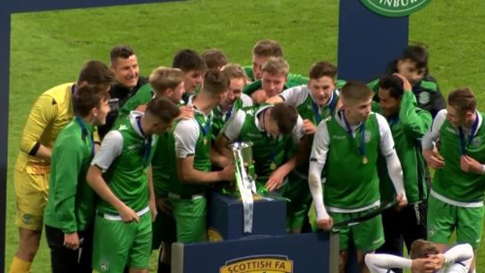 Hibernian youth team break trophy during final winning celebrations ...