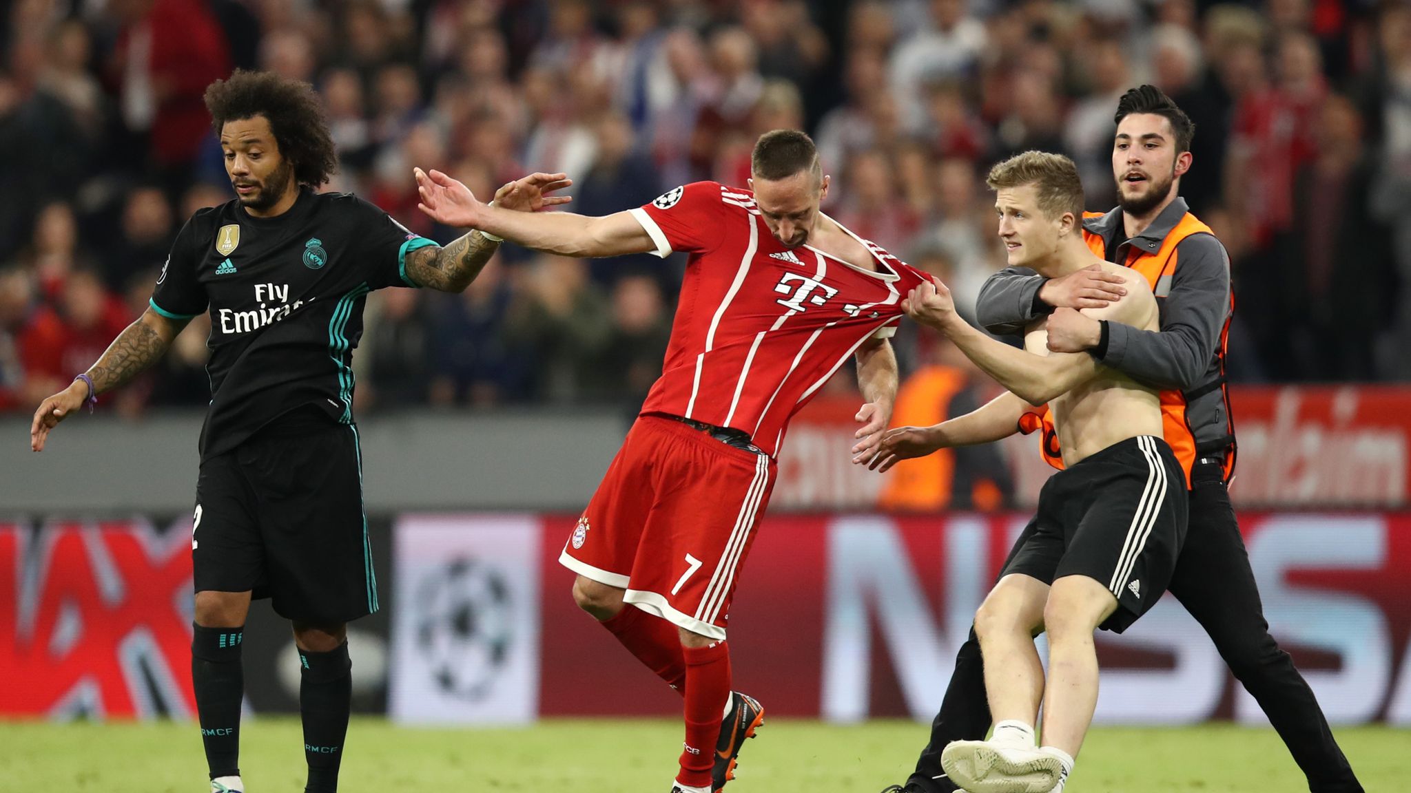 Bayern Munich charged by UEFA after pitch invasion in Real Madrid ...