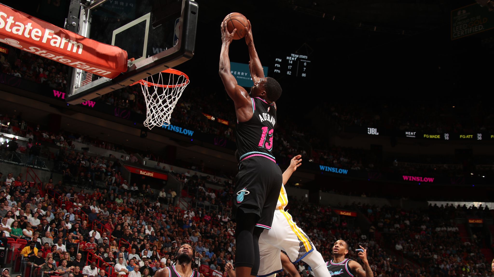 Trae Young tees up John Collins for acrobatic reverse alley-oop slam in ...