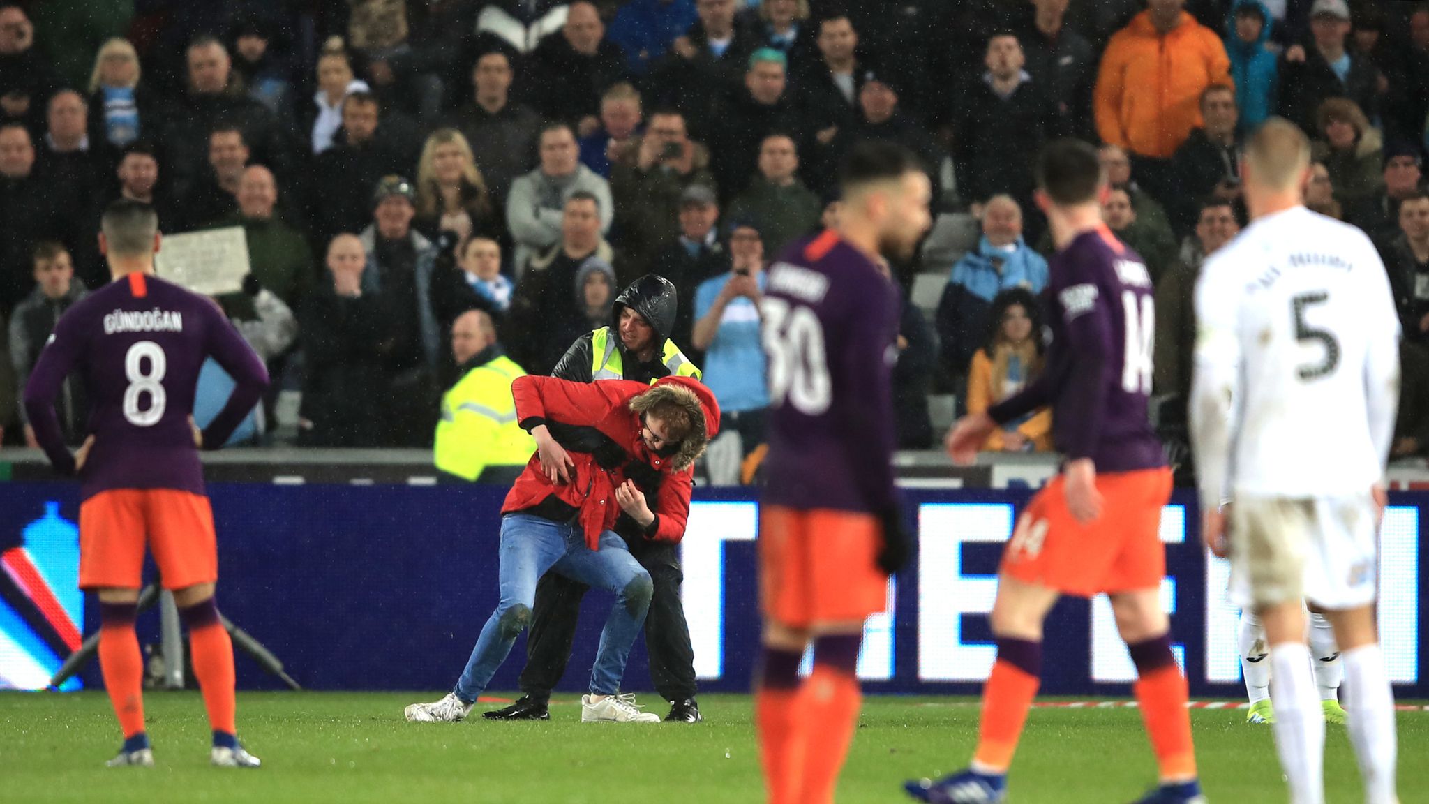 Man charged and two teenagers cautioned over Swansea City pitch ...