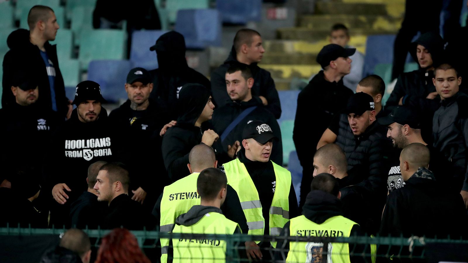 Bulgarian stewards ditched hi-vis vests to join fans in match against ...