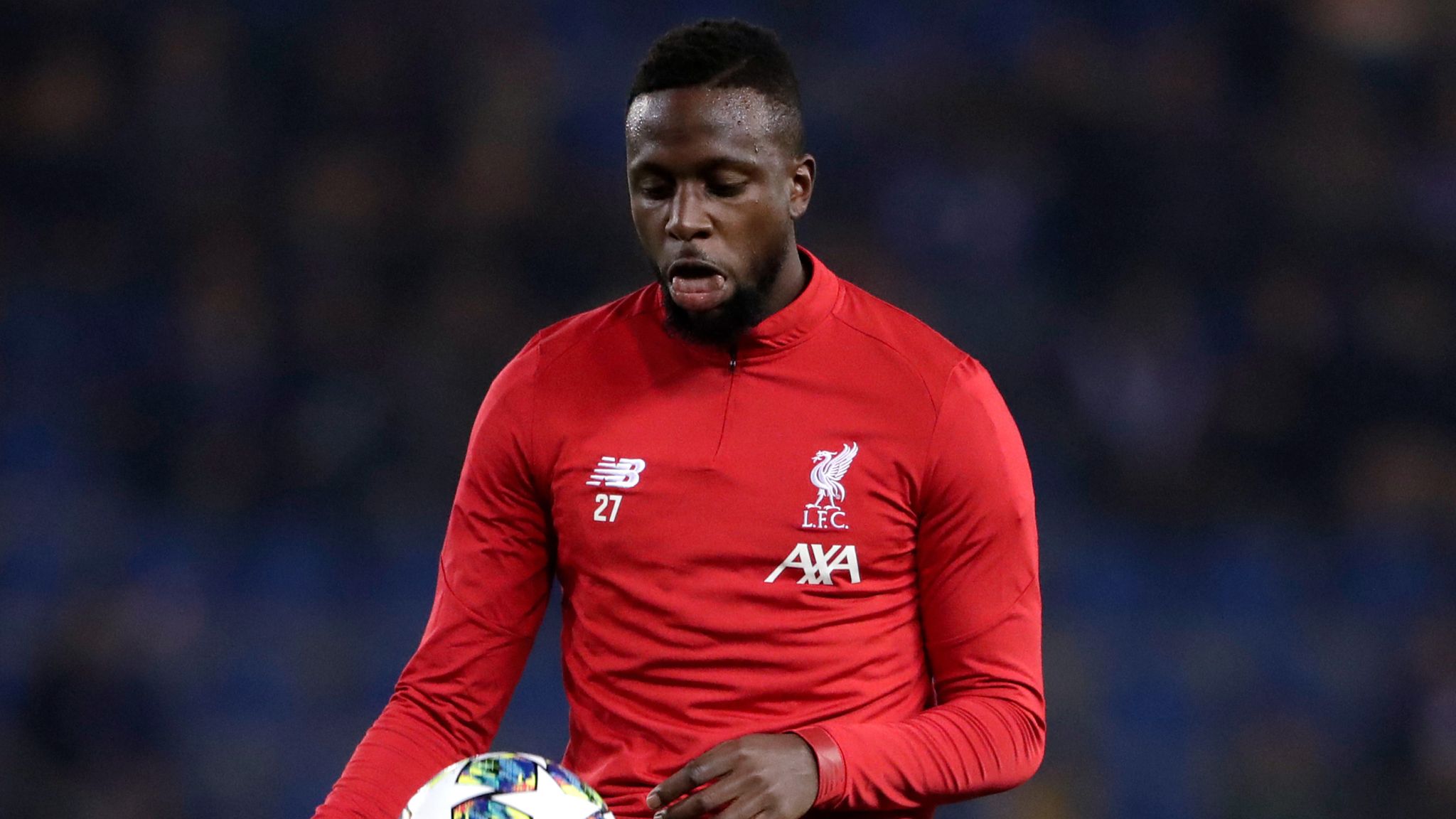 Divock Origi: Police question fan over banner at Liverpool game ...