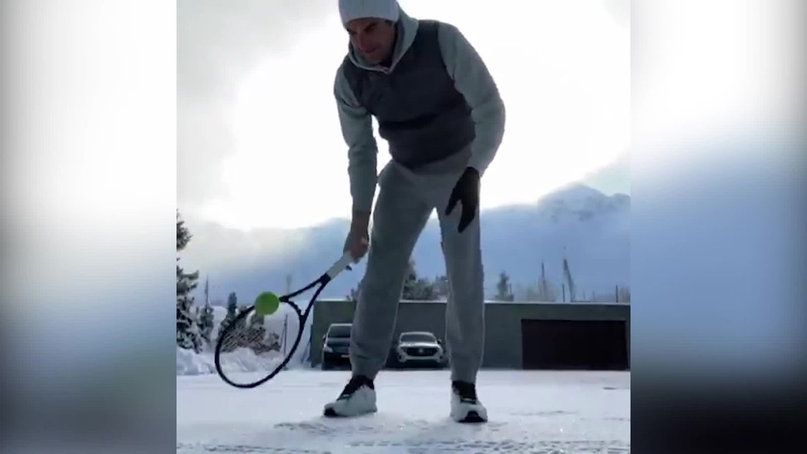 Roger Federer shows his repertoire of tennis skills at home in the snow ...