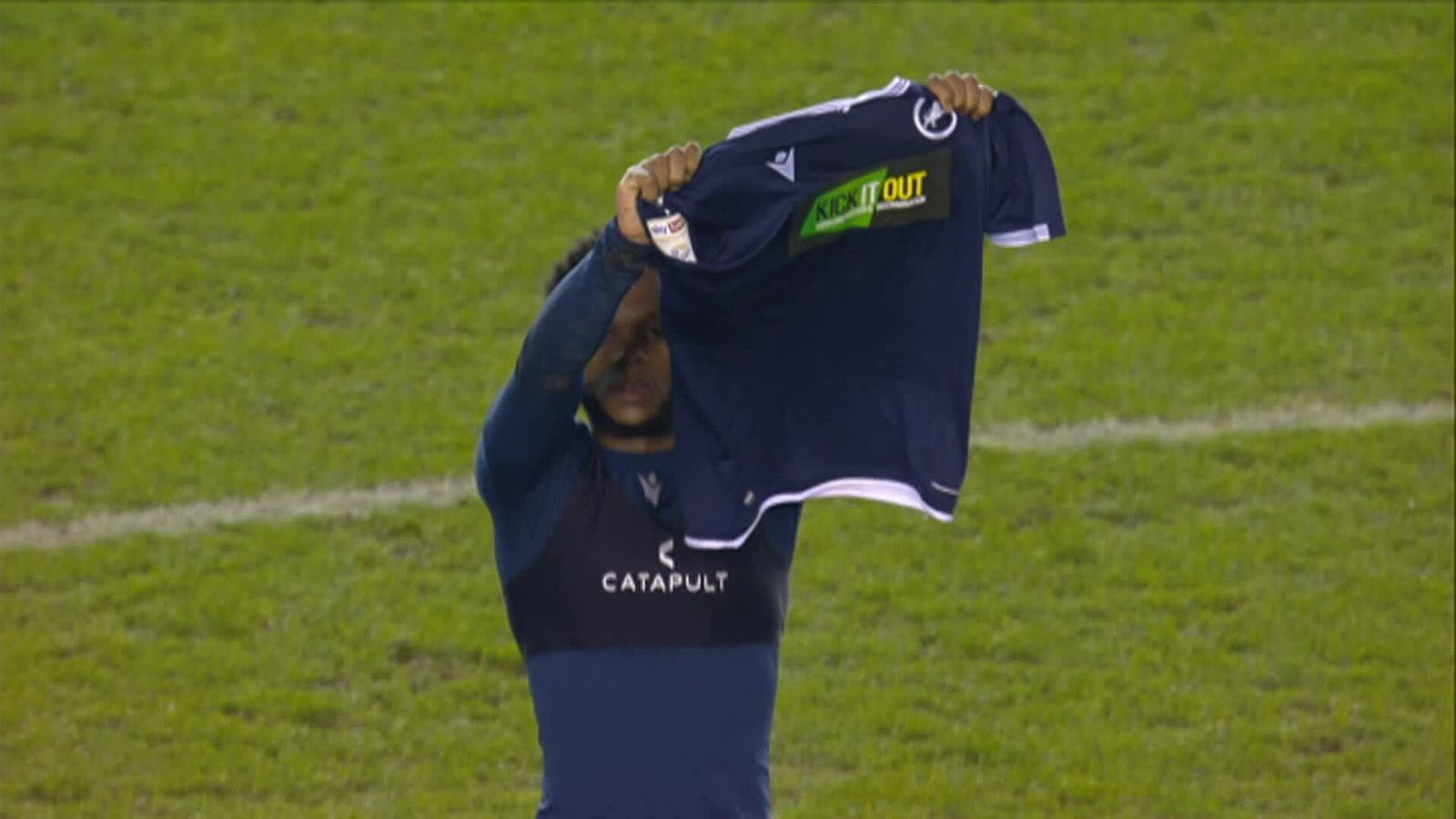 Mahlon Romeo shows Kick It Out sponsorship to fans at Millwall ...