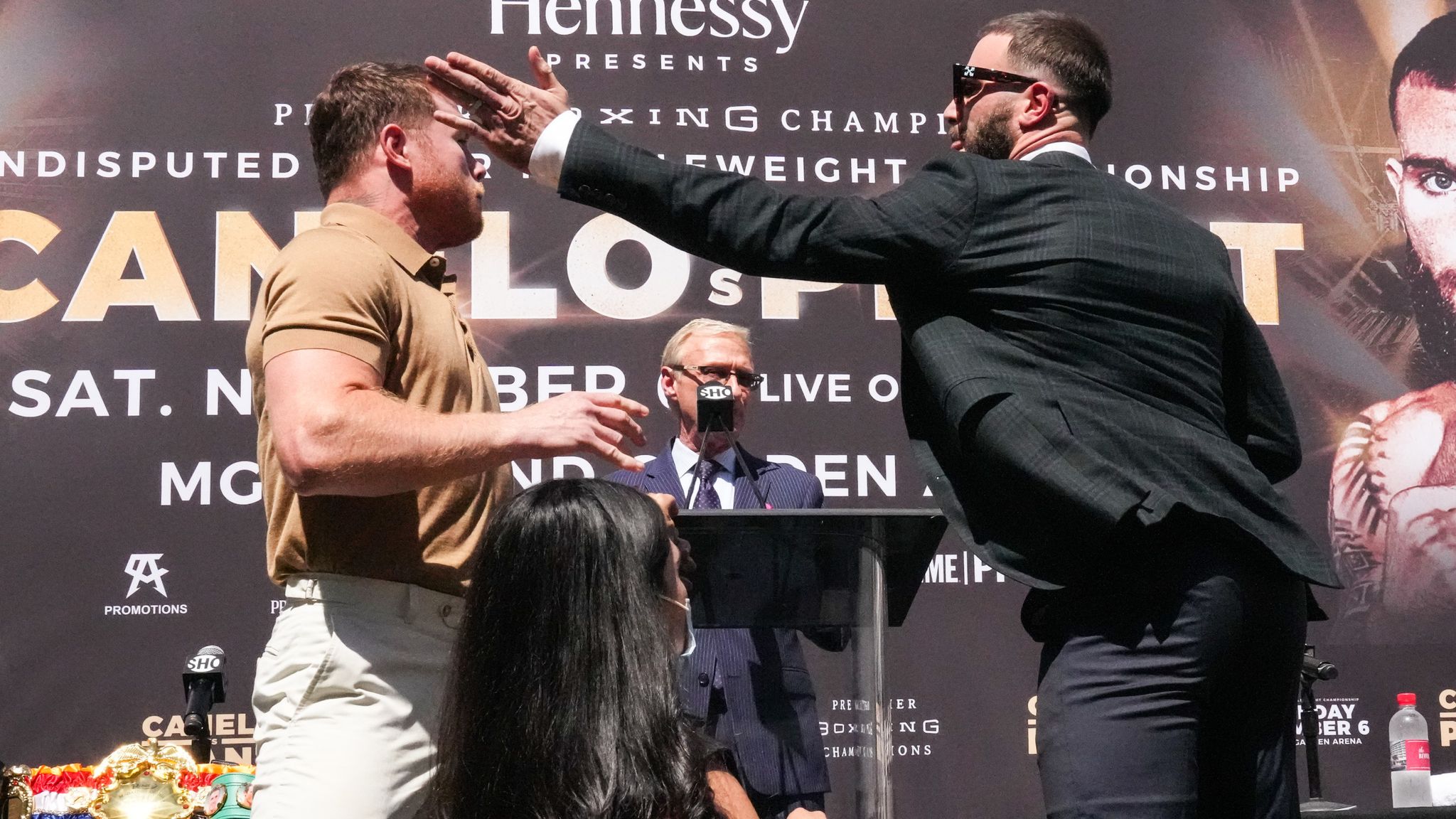 Saul 'Canelo' Alvarez and Caleb Plant throw punches during face-off ...