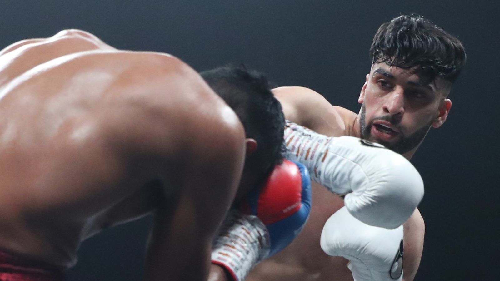 Adam Azim drops and dominates Santos Reyes but goes 10 rounds for first ...