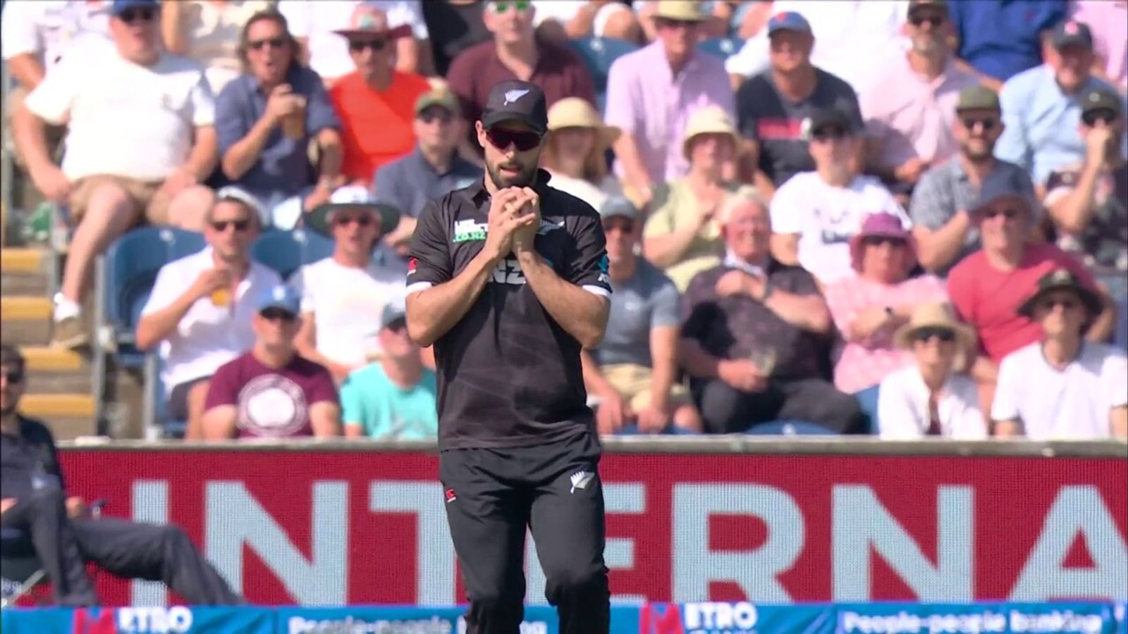 Joe Root goes for the slog-sweep then gets caught out by Daryl Mitchell ...