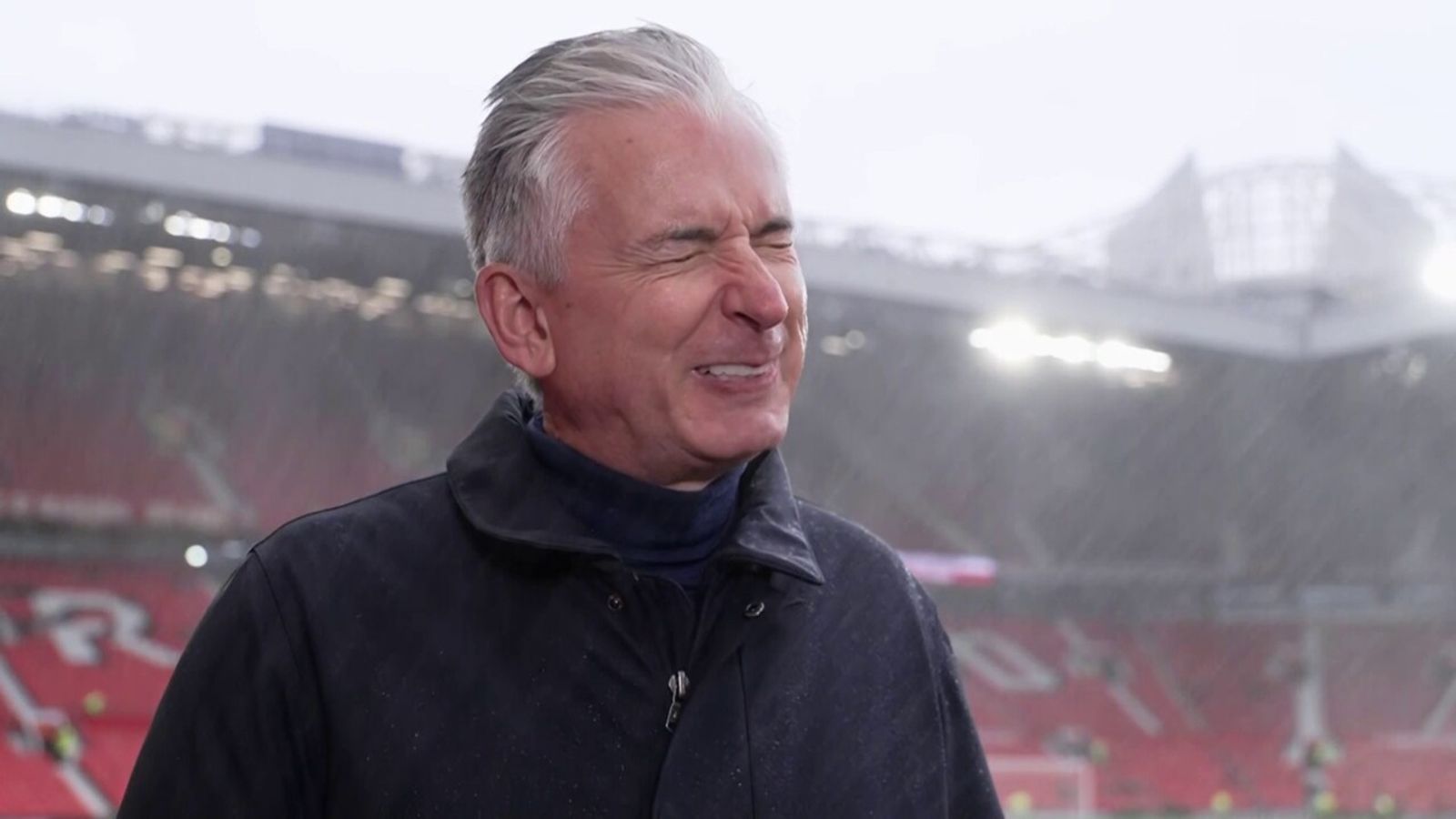 The consummate professional! Alan Smith drenched during pitchside ...
