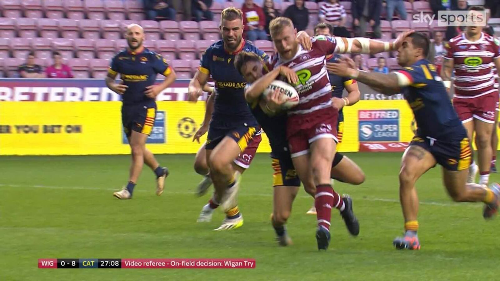 Wigan Warriors' Luke Thompson powers through Catalans Dragons defence ...