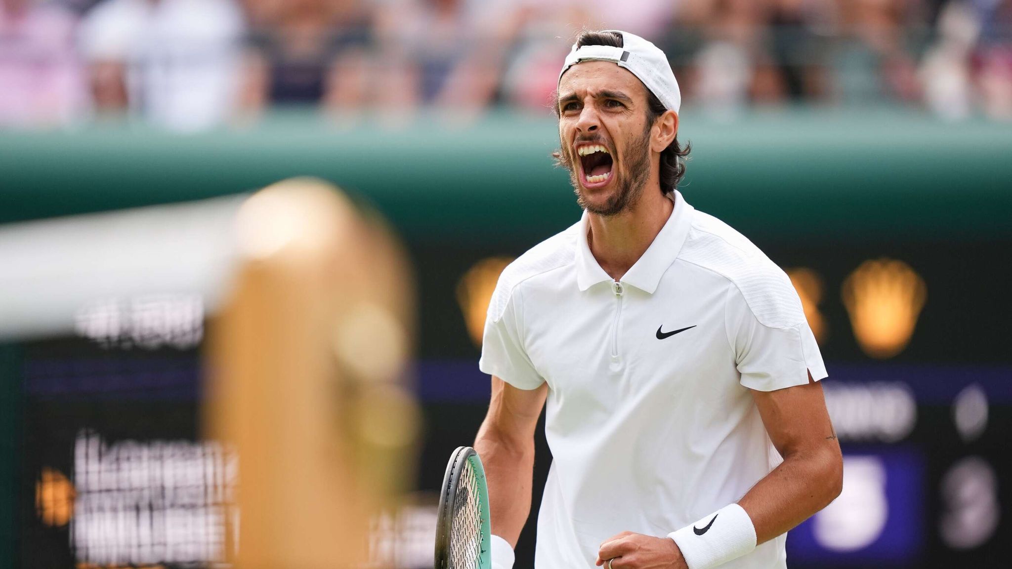 Wimbledon: Lorenzo Musetti fights back to beat Taylor Fritz and set up semi-final vs Novak ...