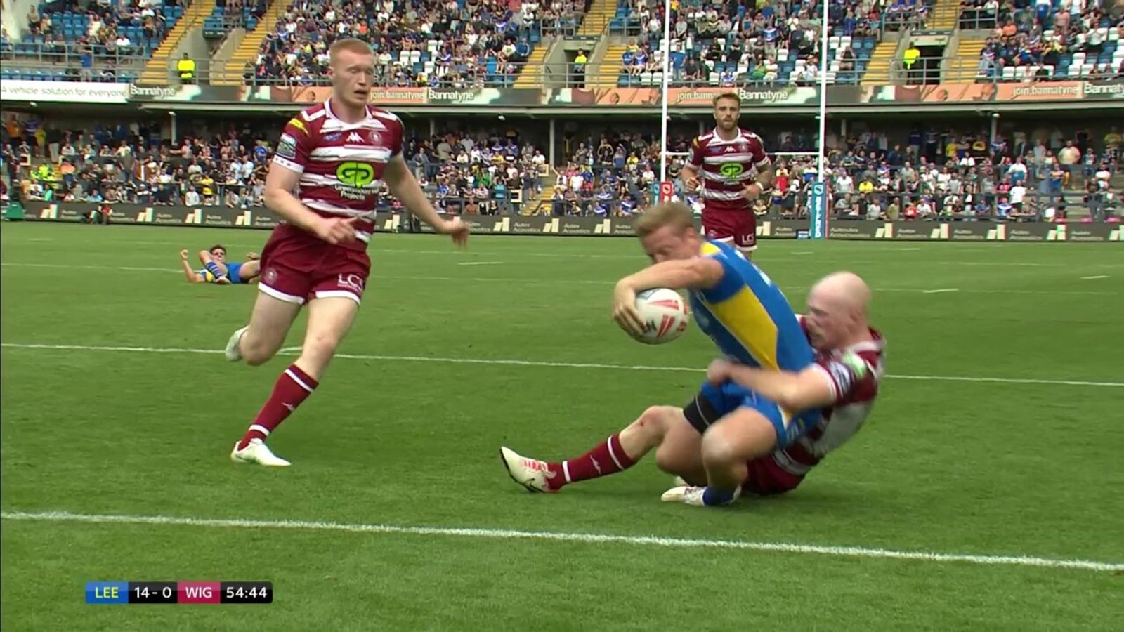 Leeds Rhinos on the charge against Wigan Warriors with another ...